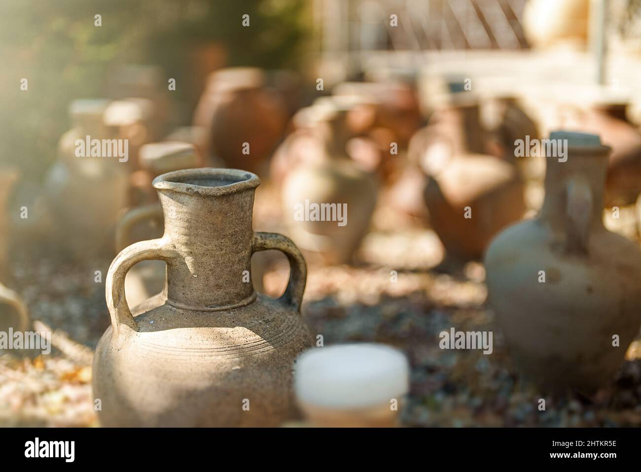 Many ancient jugs on the street Stock Photo - Alamy