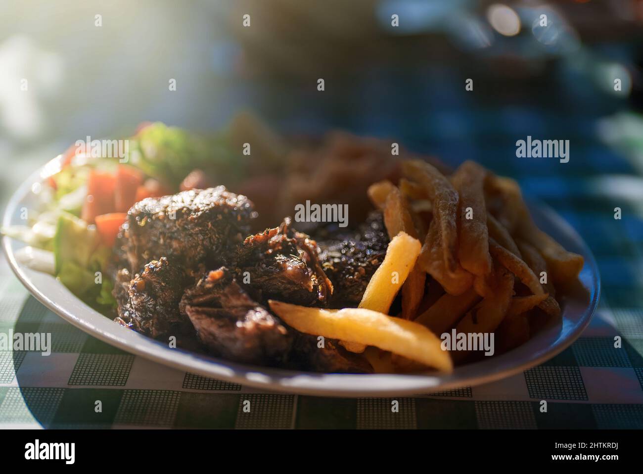 Traditional Greek Beef Stifado with rice and french fries Stock Photo ...