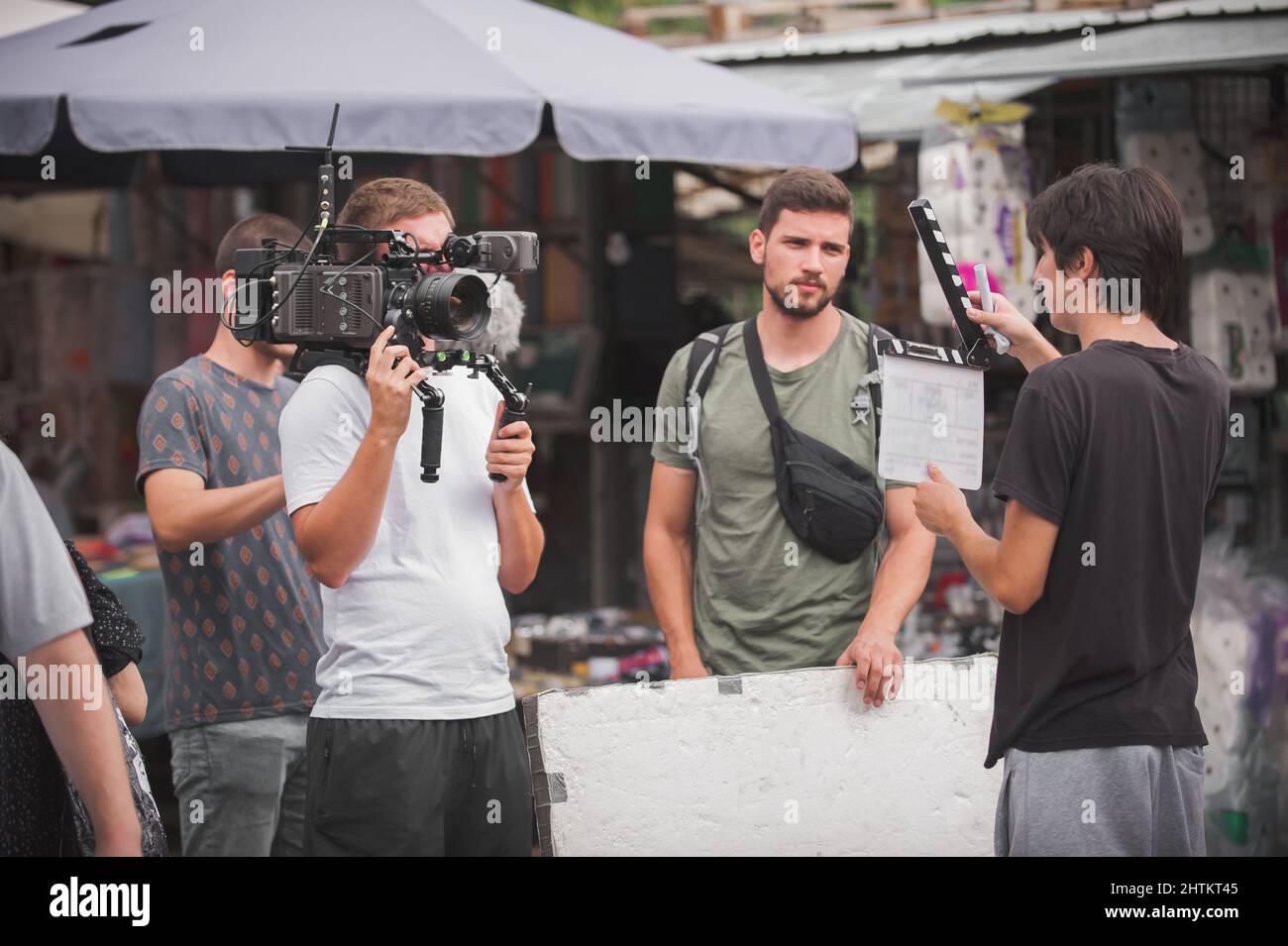Behind the scenes. Film crew team shooting movie scene on outdoor ...