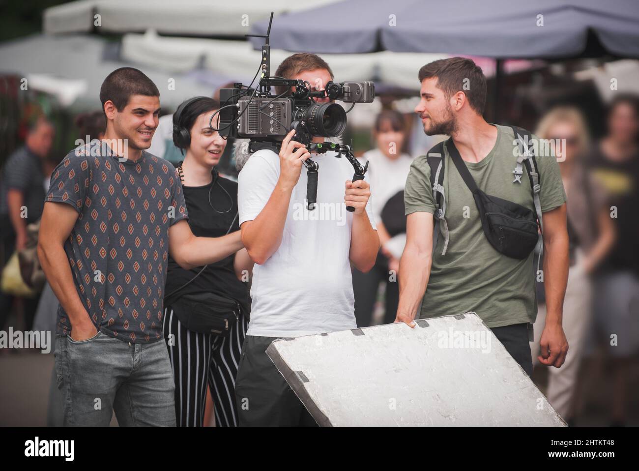 Behind the scenes. Film crew team shooting movie scene on outdoor ...