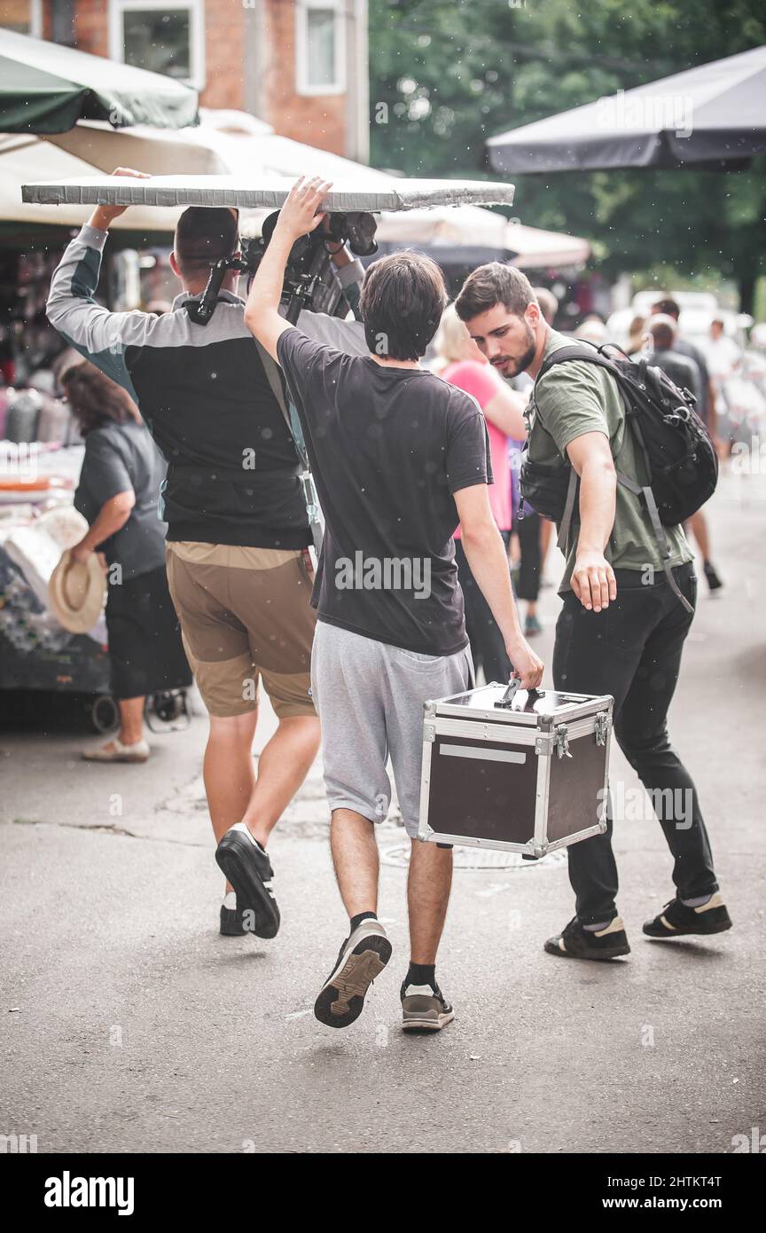 Behind the scenes. Film crew team shooting movie scene on outdoor ...