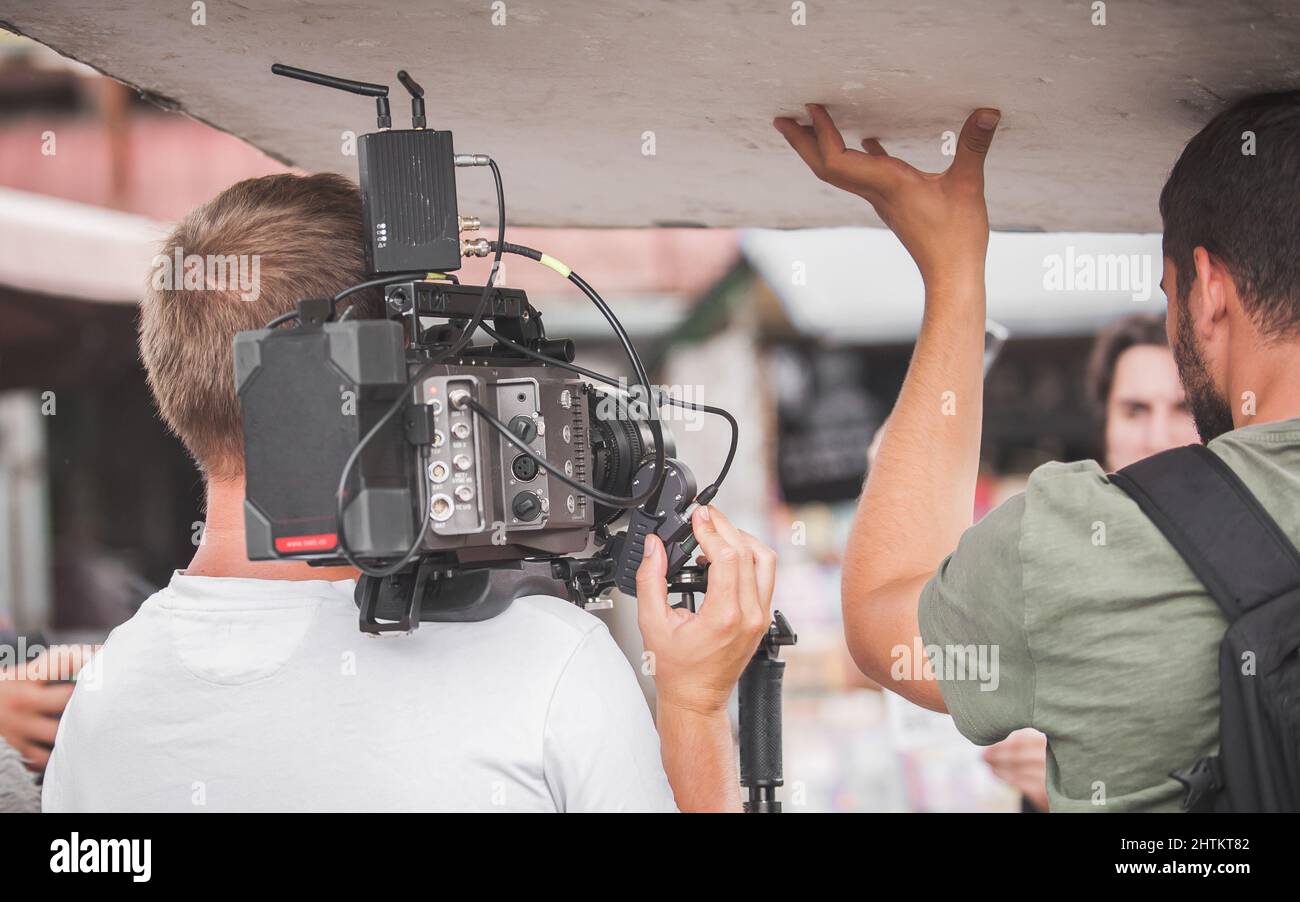Behind the scenes. Film crew team shooting movie scene on outdoor ...
