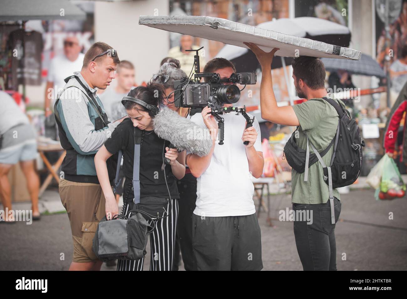 Behind the scenes. Film crew team shooting movie scene on outdoor ...