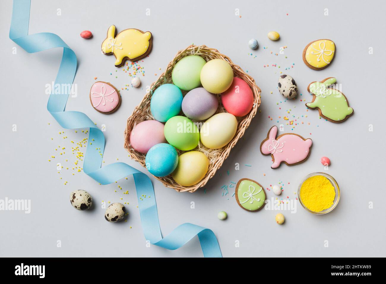 Colorful easter cookies in basket with Multi colors Easter eggs on ...