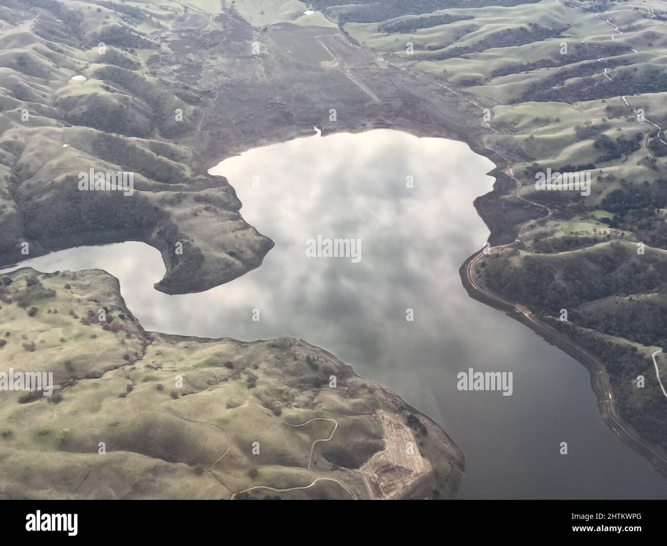 Aerial view of the lake surrounded by mountains in California Stock ...