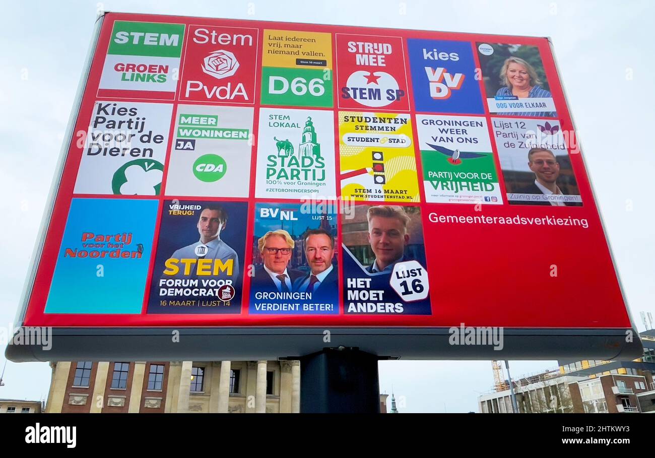 Billboard with posters for the municipal elections in the Netherlands ...
