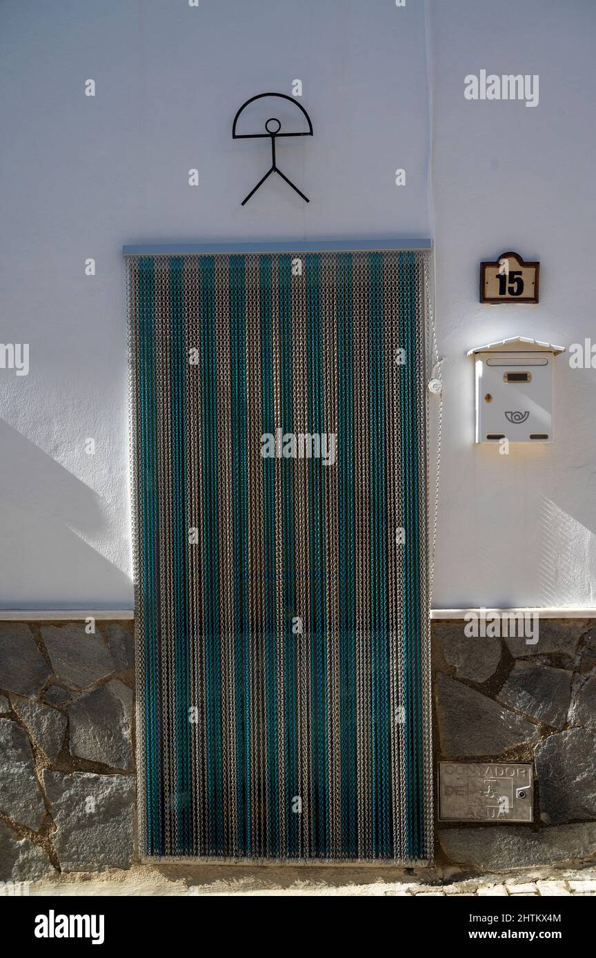 Metal Indalo Man Symbol on a wooden fence. The Indalo is an ancient ...