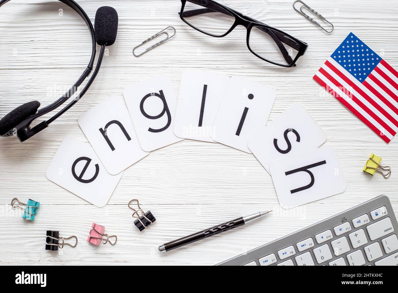 Learning English language concept. Text on student table desk, top view ...