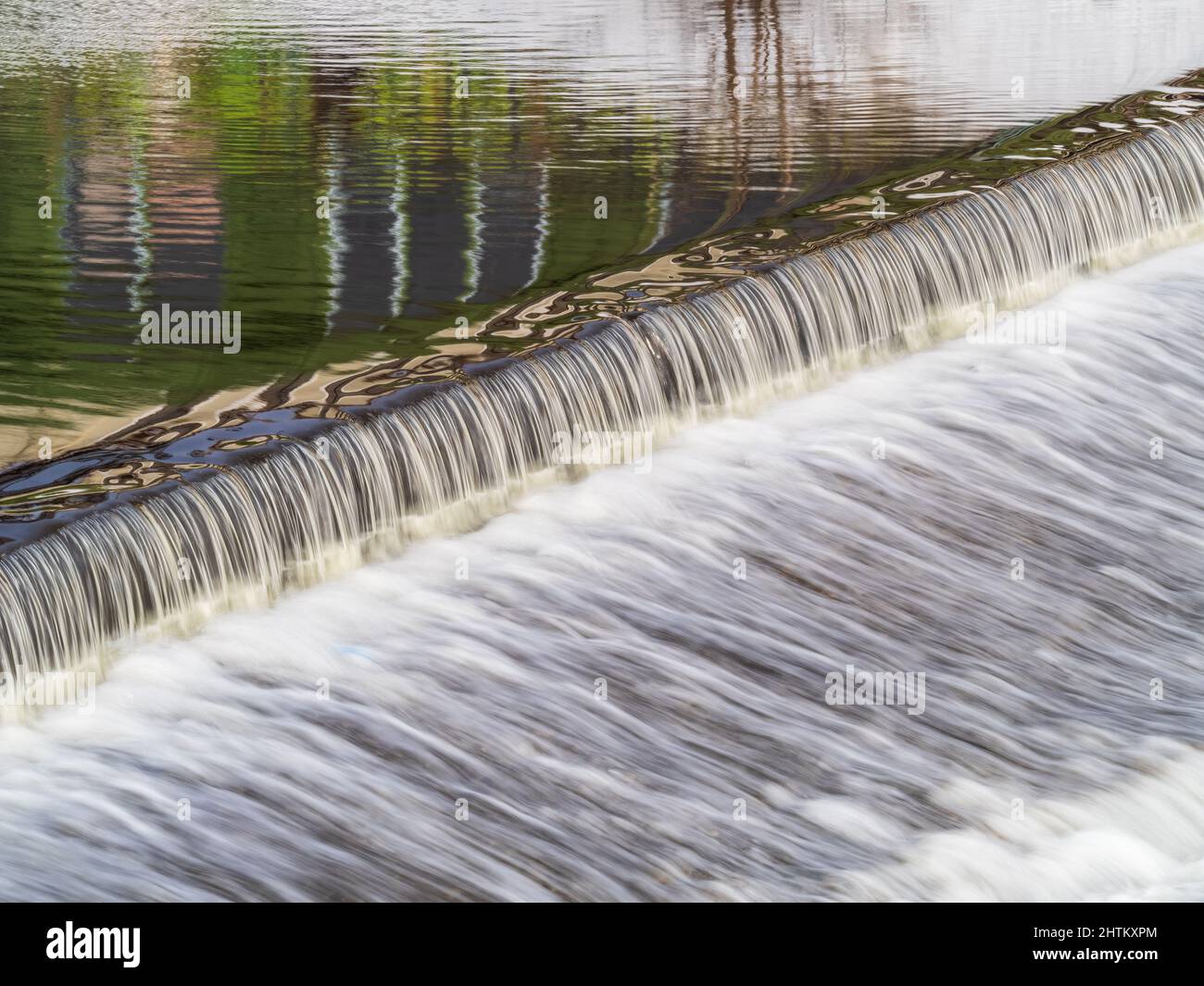 A small flat cascade in a calm river. Water background Stock Photo - Alamy