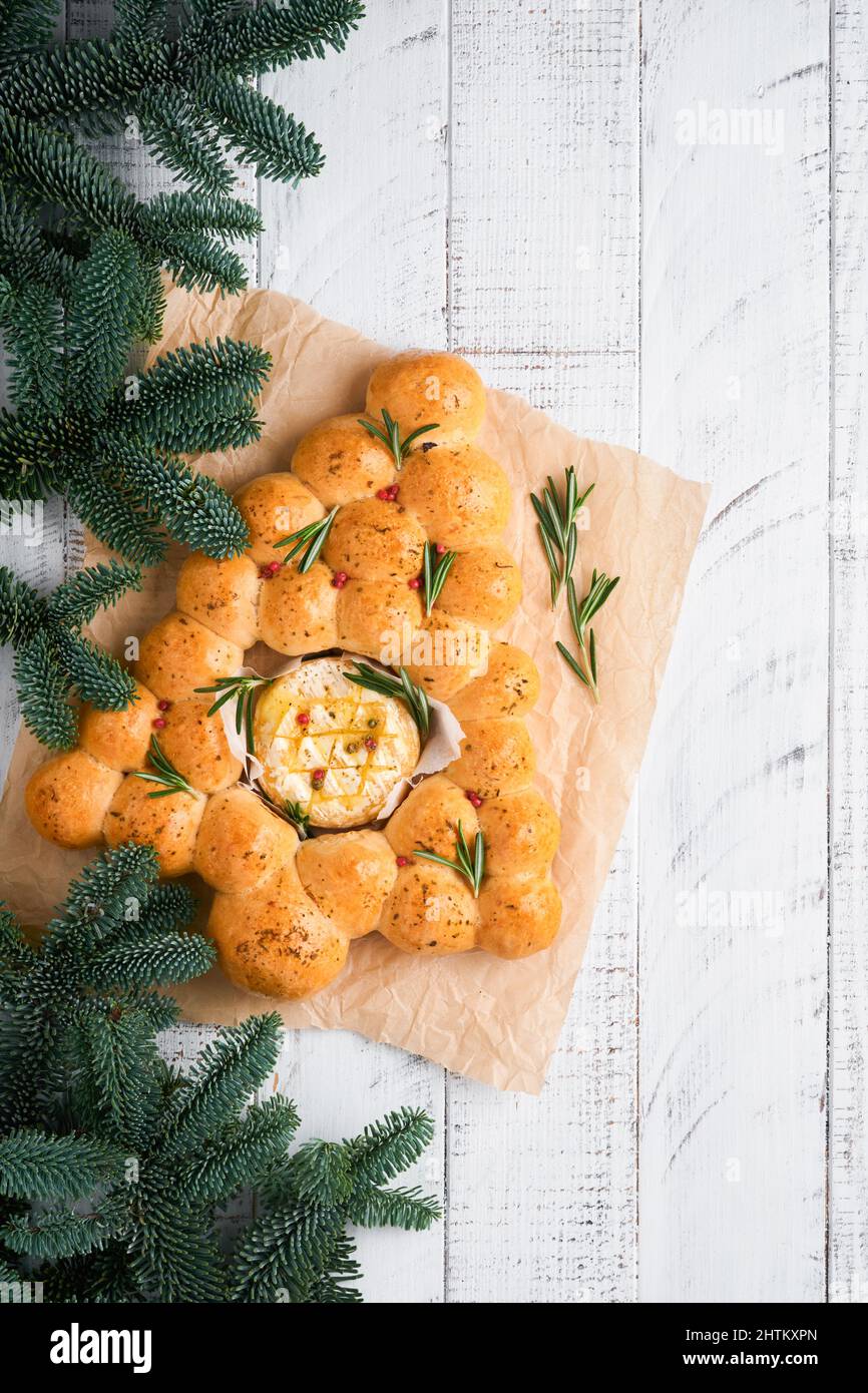 Bread buns Christmas tree with Roasted camembert cheese and rosemary on ...