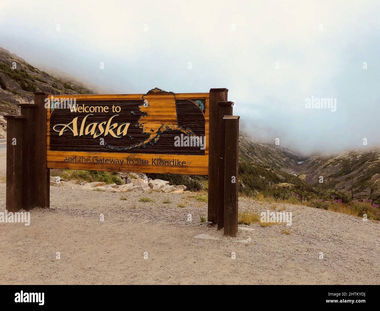 Welcome to Alaska billboard against clouds Stock Photo - Alamy