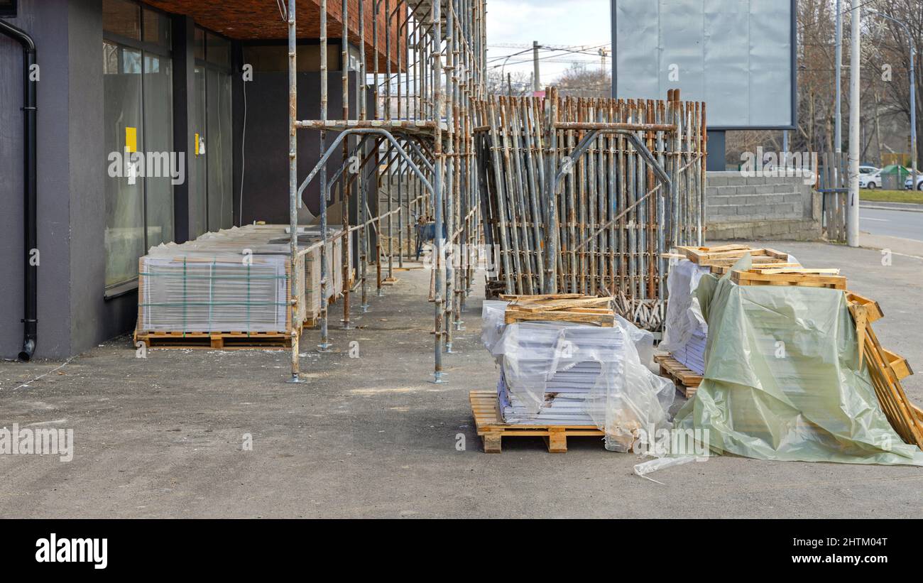 Pallets With Boxes of Material at Construction Site Scaffolding Stock ...
