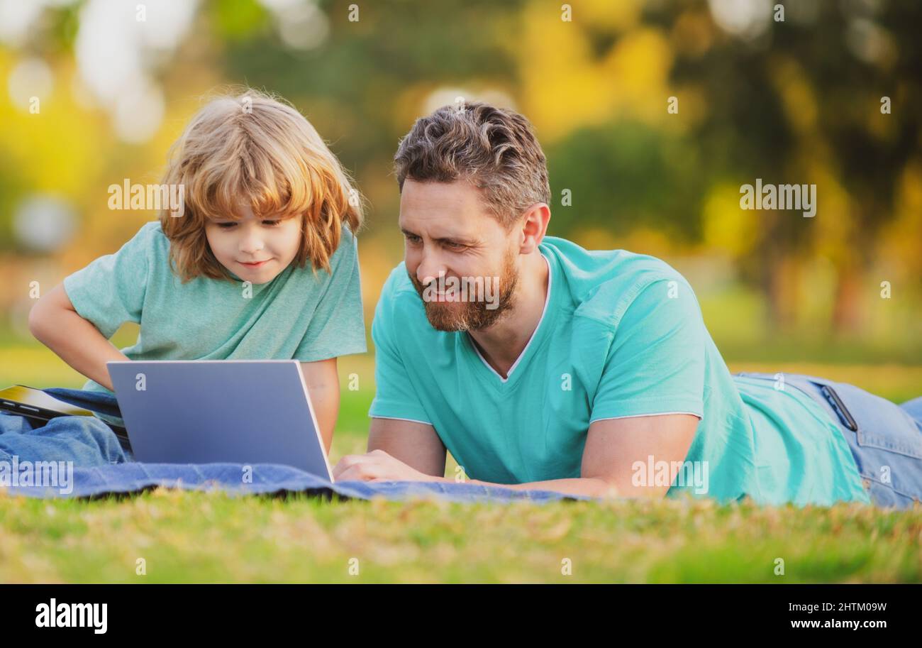 Father and son online learning. Concept of friendly family. Kid with a ...