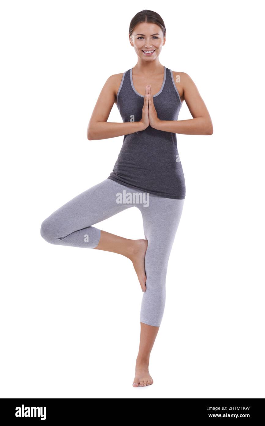 Perfectly balanced. A young brunette woman practicing the art of ...