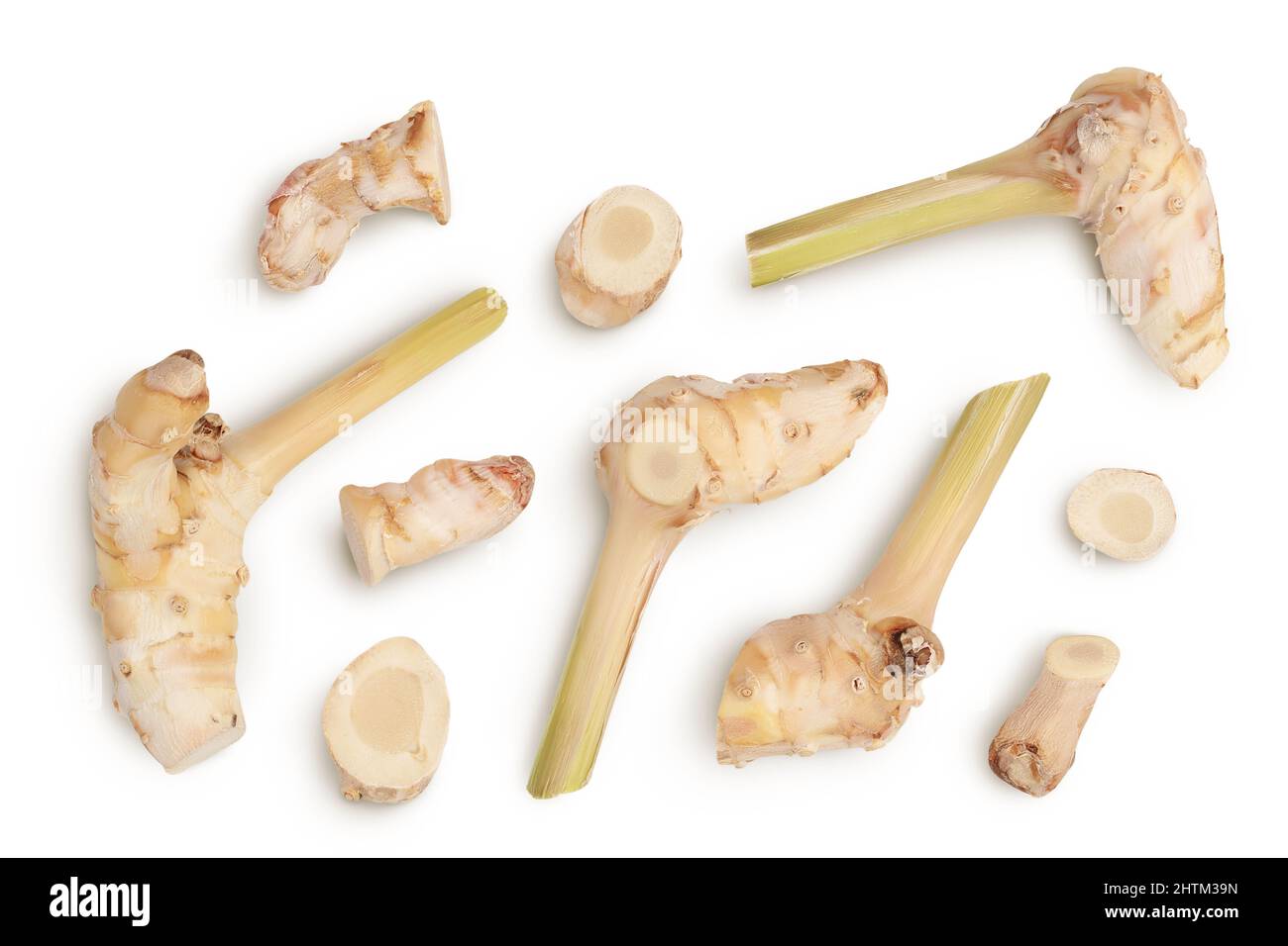 Fresh galangal root with slices isolated on white background with ...