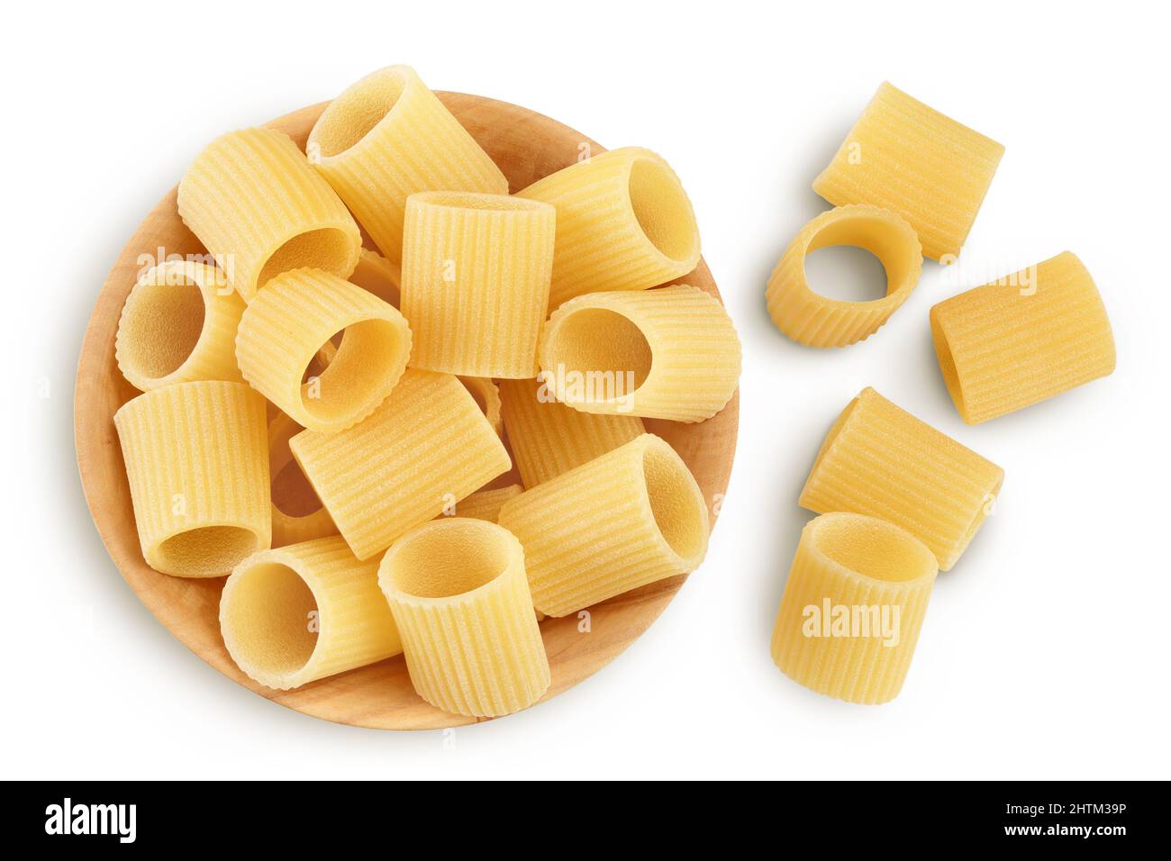 raw italian pasta in wooden bowl isolated on white background with ...