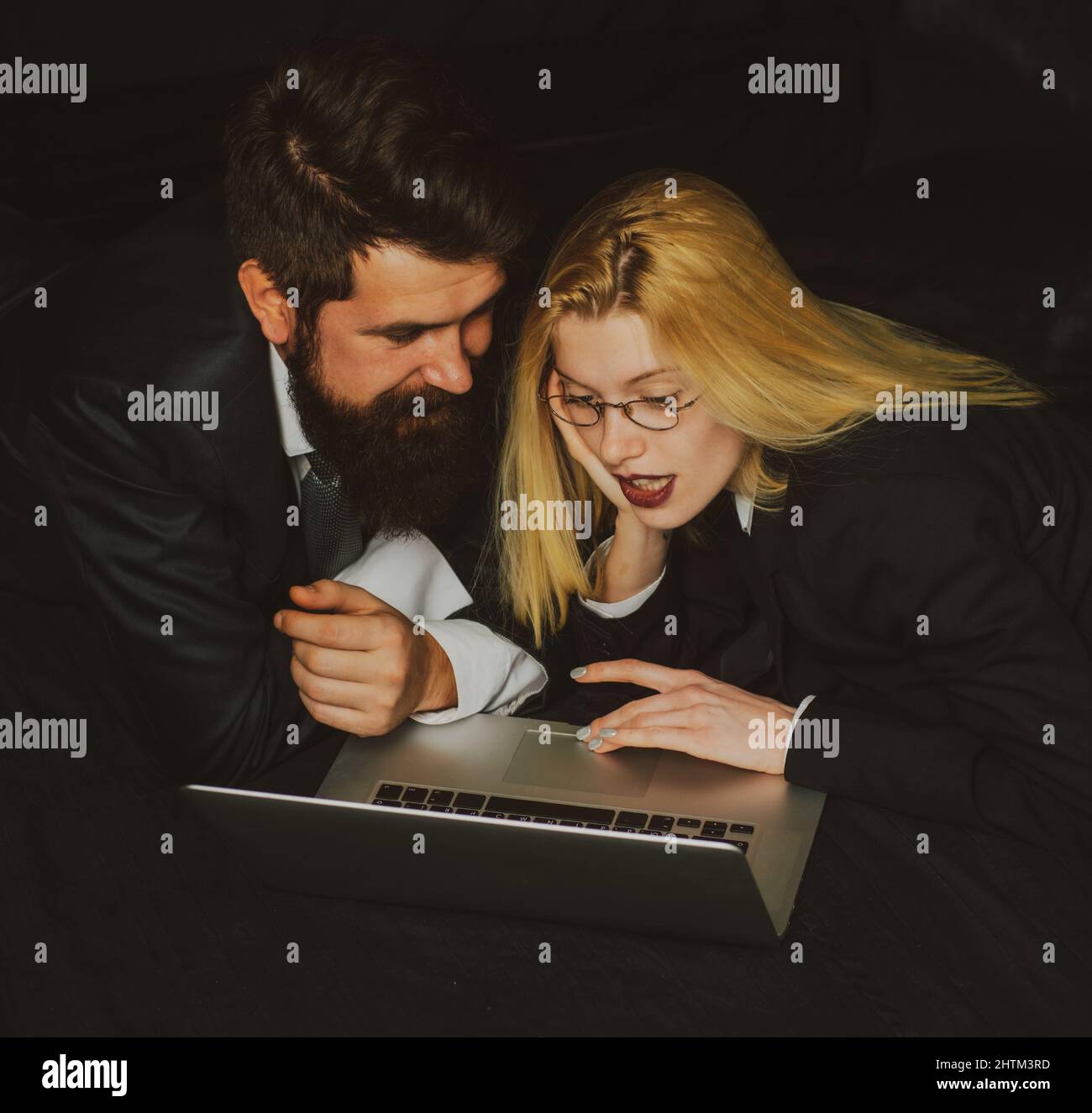 Business management. Working together on project. Two young business ...