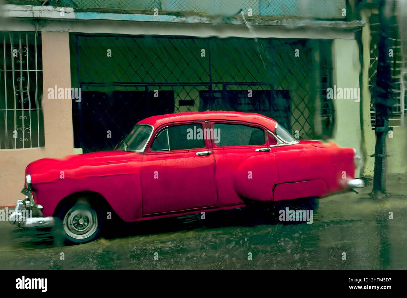Classic car in rain, Cuba Stock Photo - Alamy