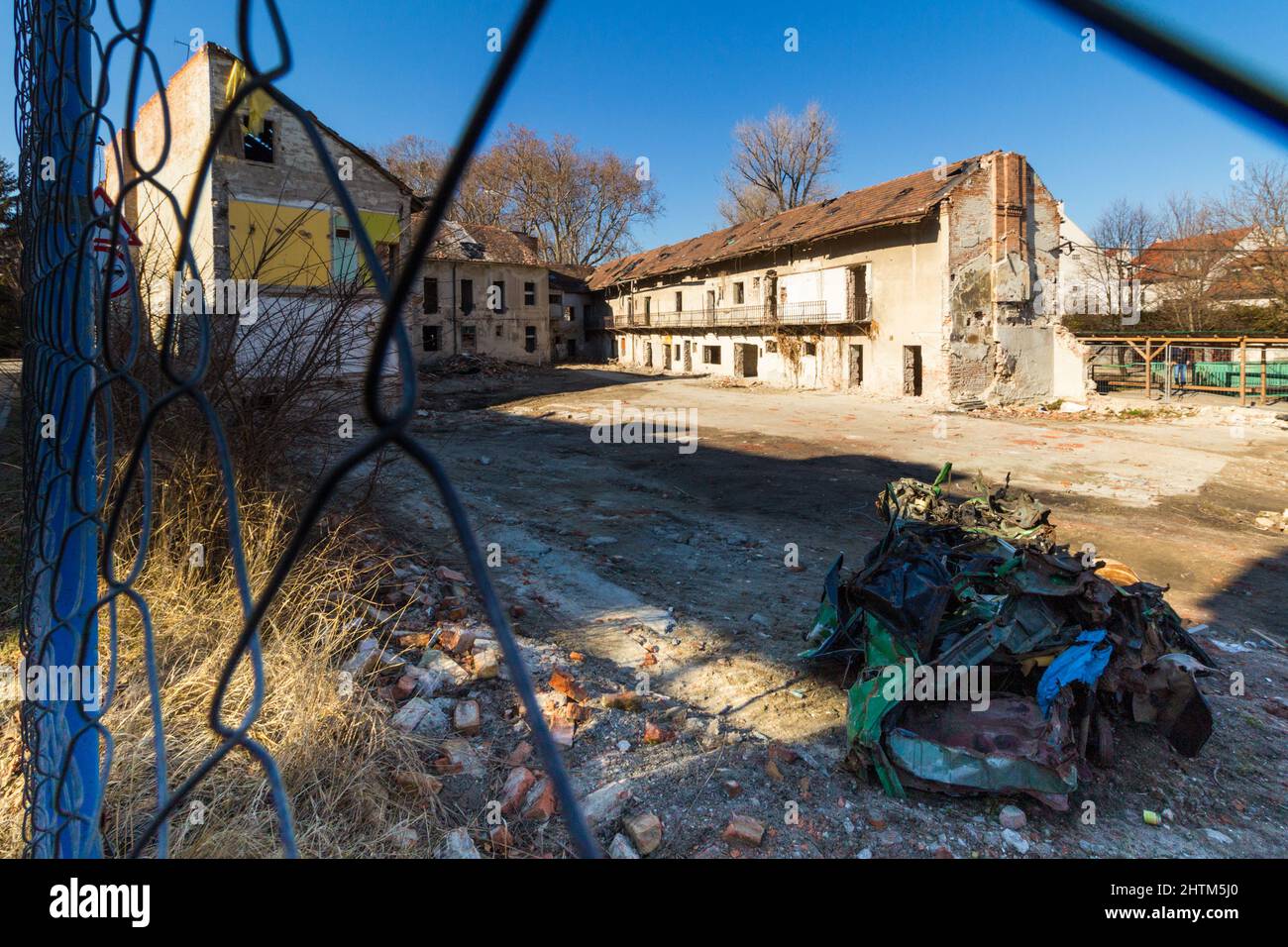 Old abandoned, empty building to be demolished and car wreck on ...