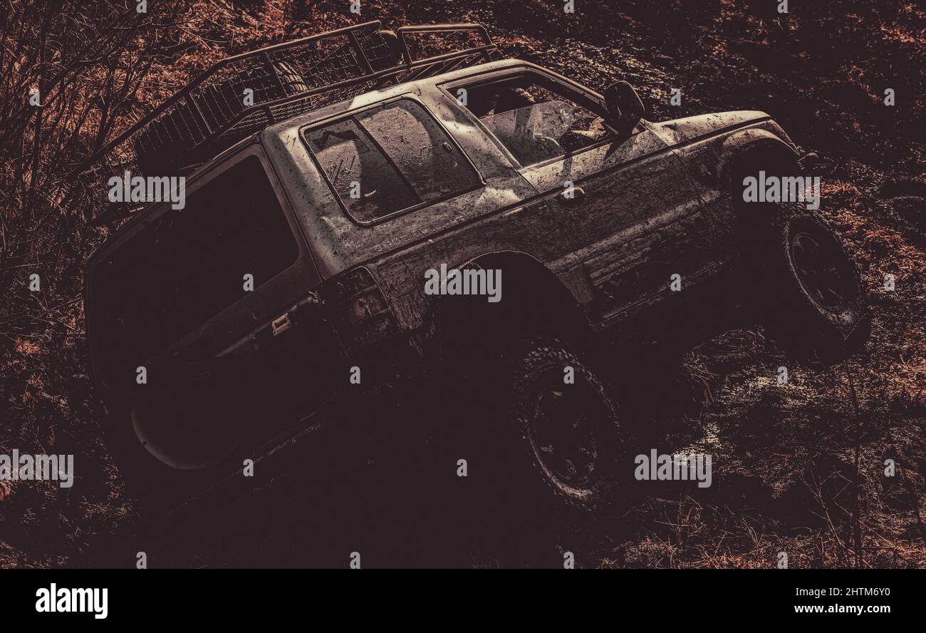 Tracks on a muddy field. Bottom view to big offroad car wheel on ...