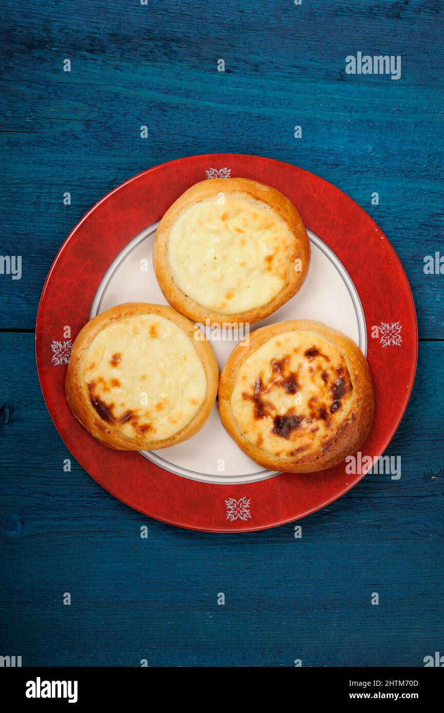 Homemade vatrushki, small Russian cakes with cottage cheese on deep ...