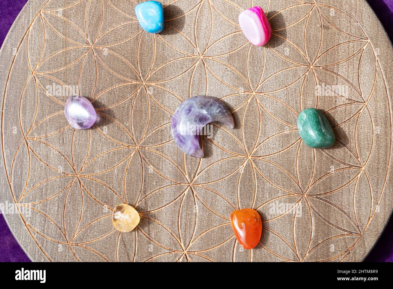 Healing crystals on brown background Stock Photo - Alamy