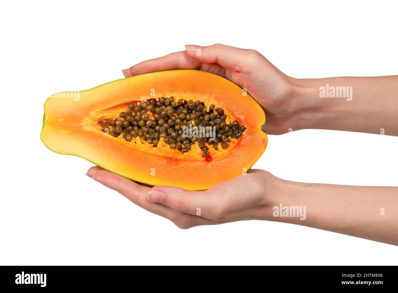 Papaya fruit isolated on a white background in woman hands. Tropical ...