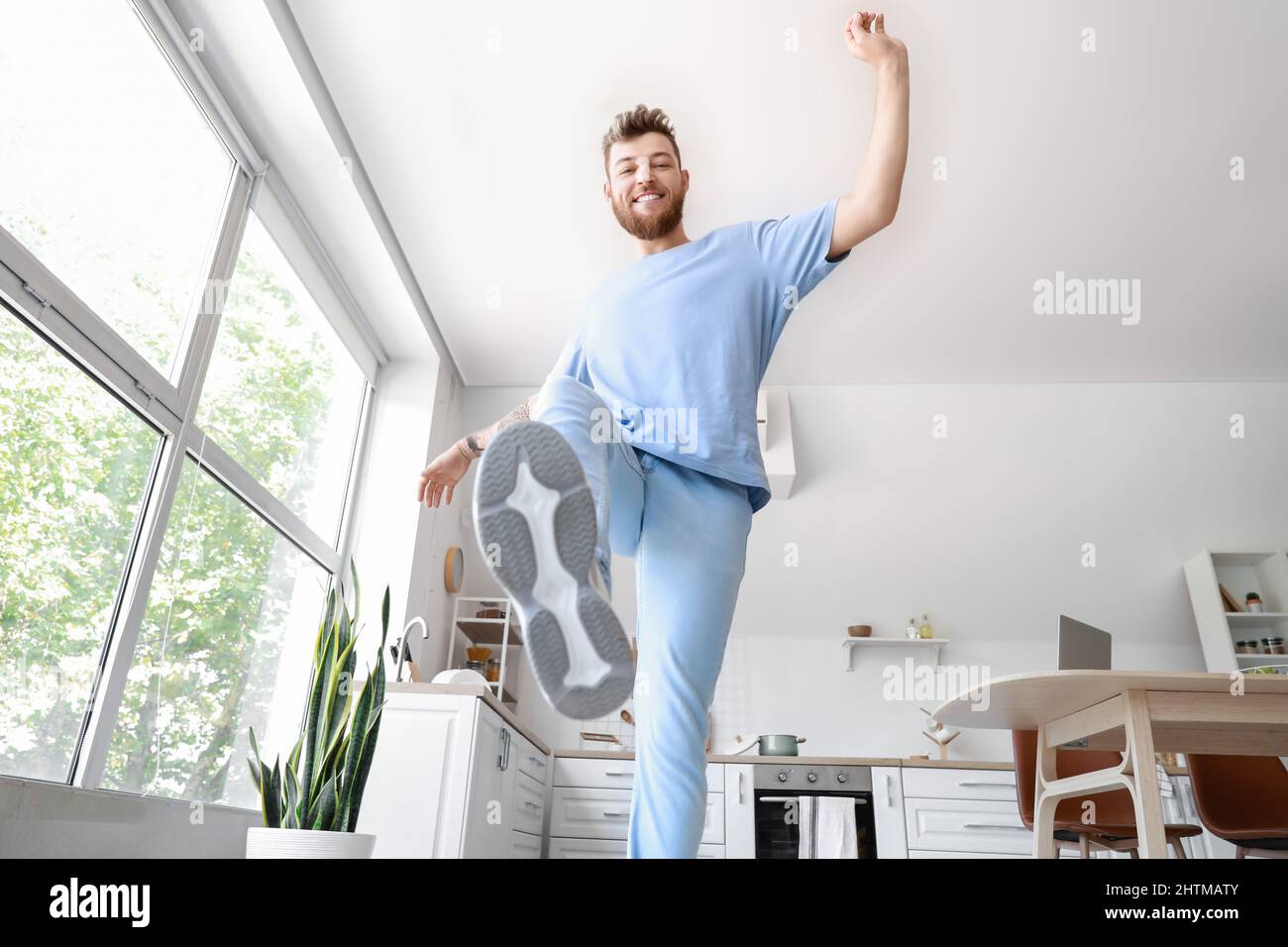 Cool young man dancing at home Stock Photo - Alamy