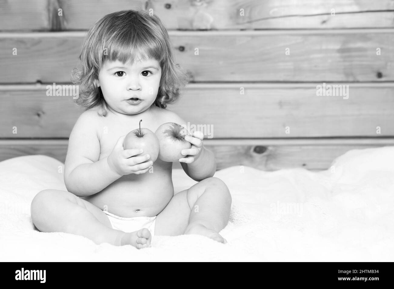 Cute baby eat apple. Solid food for infant. Child eating, nutrition ...