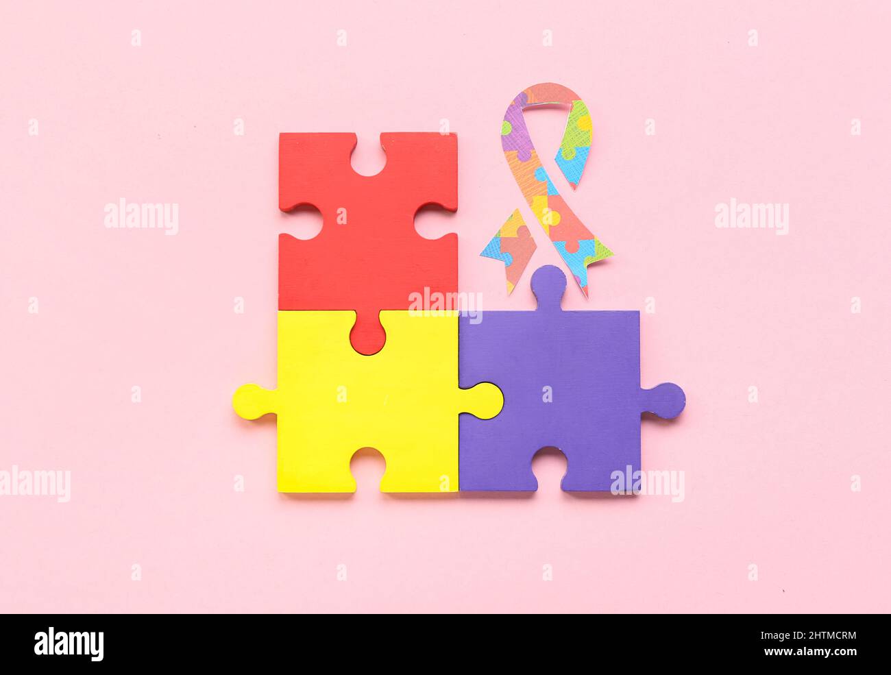 Puzzle pieces with awareness ribbon on pink background. Concept of ...