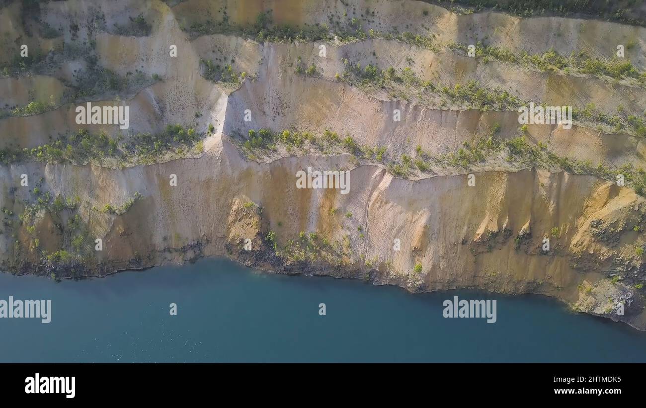 Abandoned large quarry filled with water. Clip. Top view of quarry ...