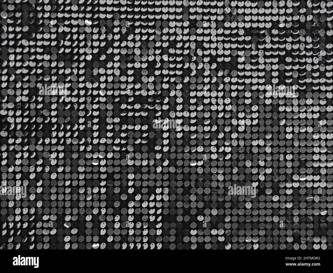 Abstract background with flickering and glittering silver metallic ...