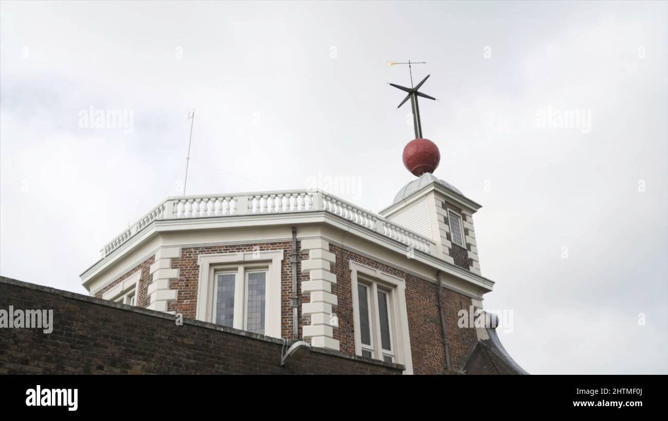 Beautiful weathervane with arrow on the house roof against the cloudy ...