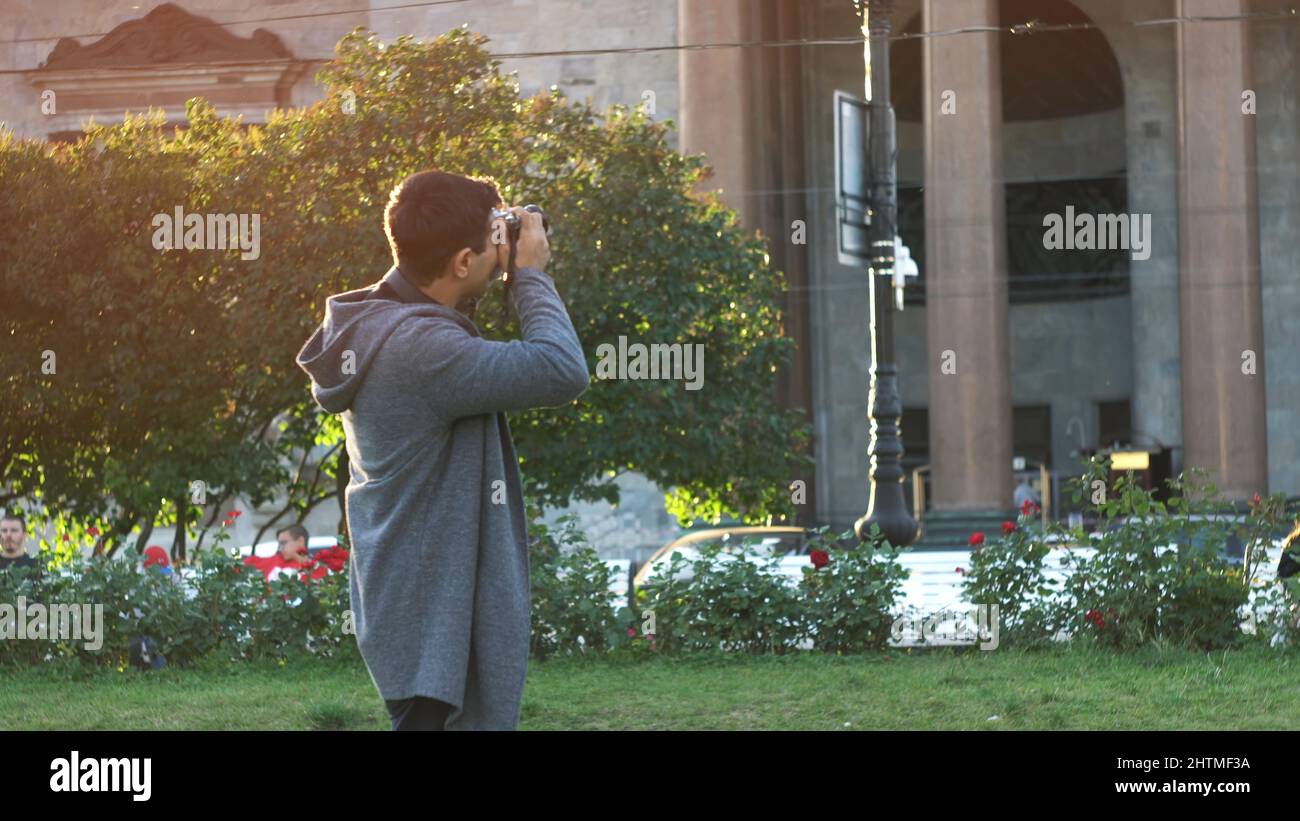 Tourist photographing sights and landmarks. Young traveler man taking ...