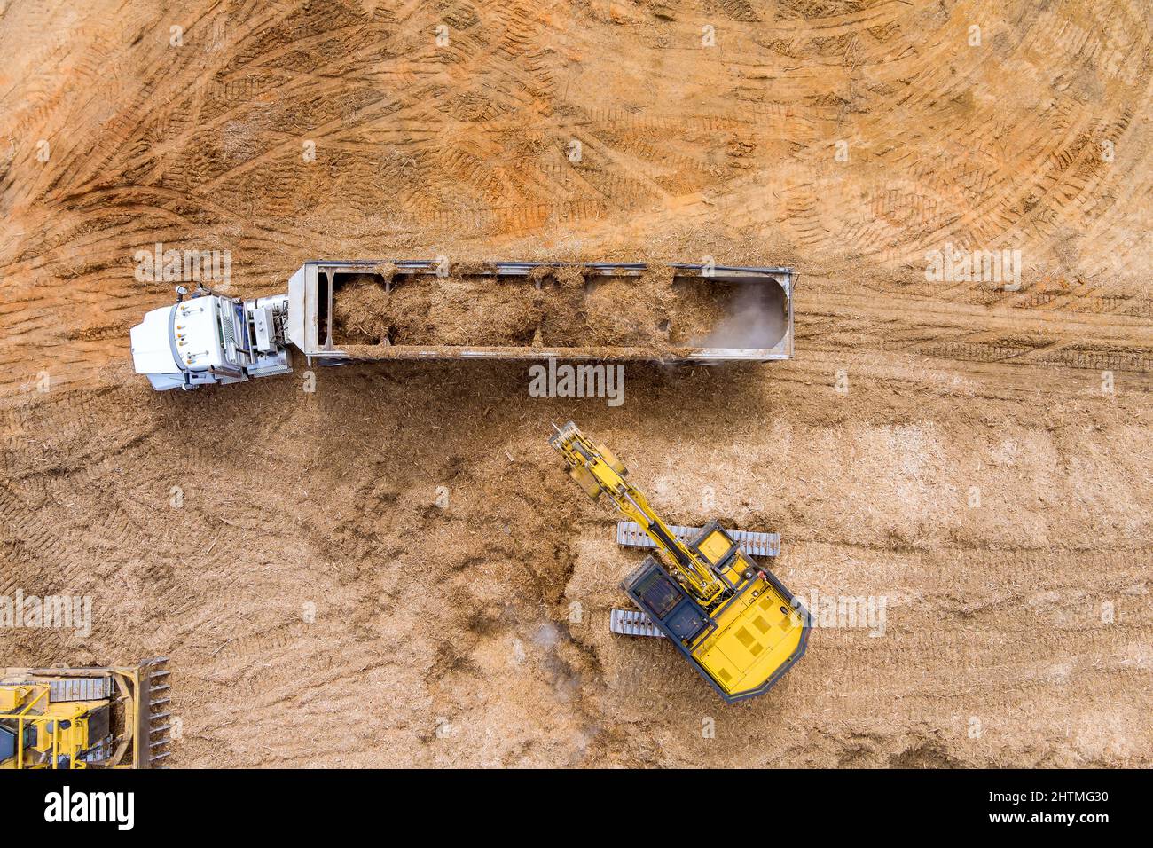 Aerial view at a crawler excavator digging soil excavating moving earth ...