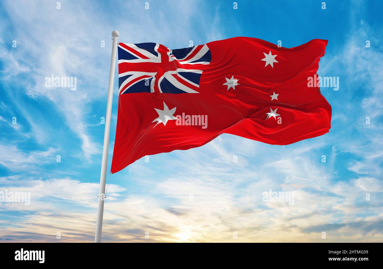flag of Civil Ensign of Australia , Australia at cloudy sky background ...