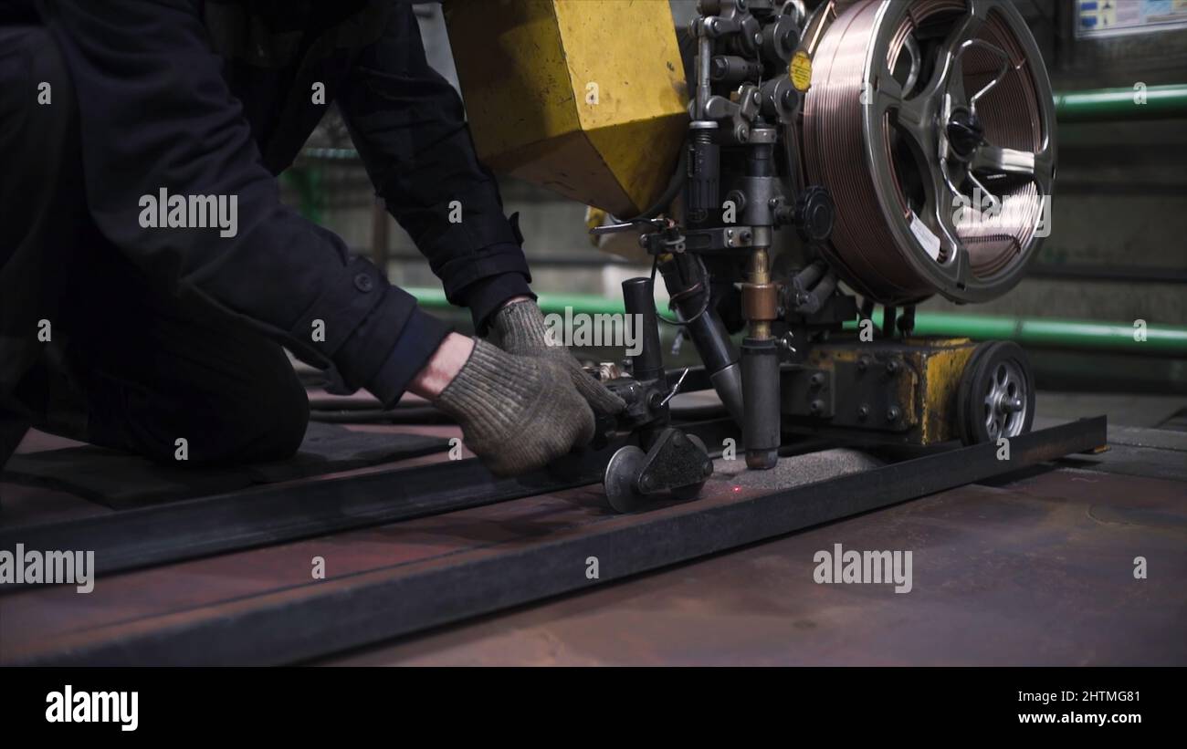 Fixed wheel of locomotive. Clip. Worker checks reliability of train ...