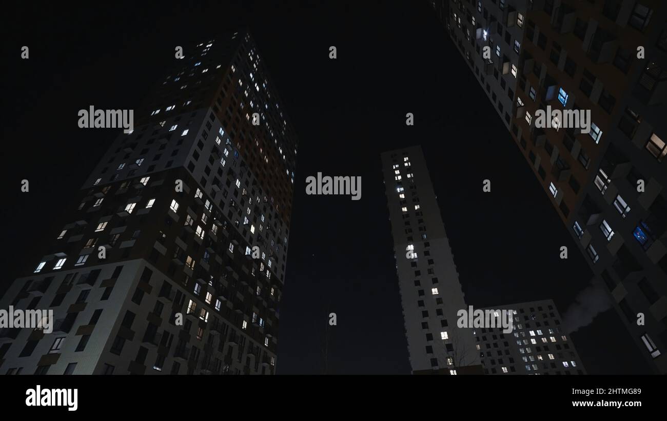 Beautiful residential buildings on background of night sky. Action ...