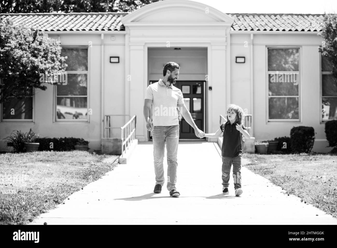 Parent and pupil of primary school go hand in hand. Pupil of primary ...