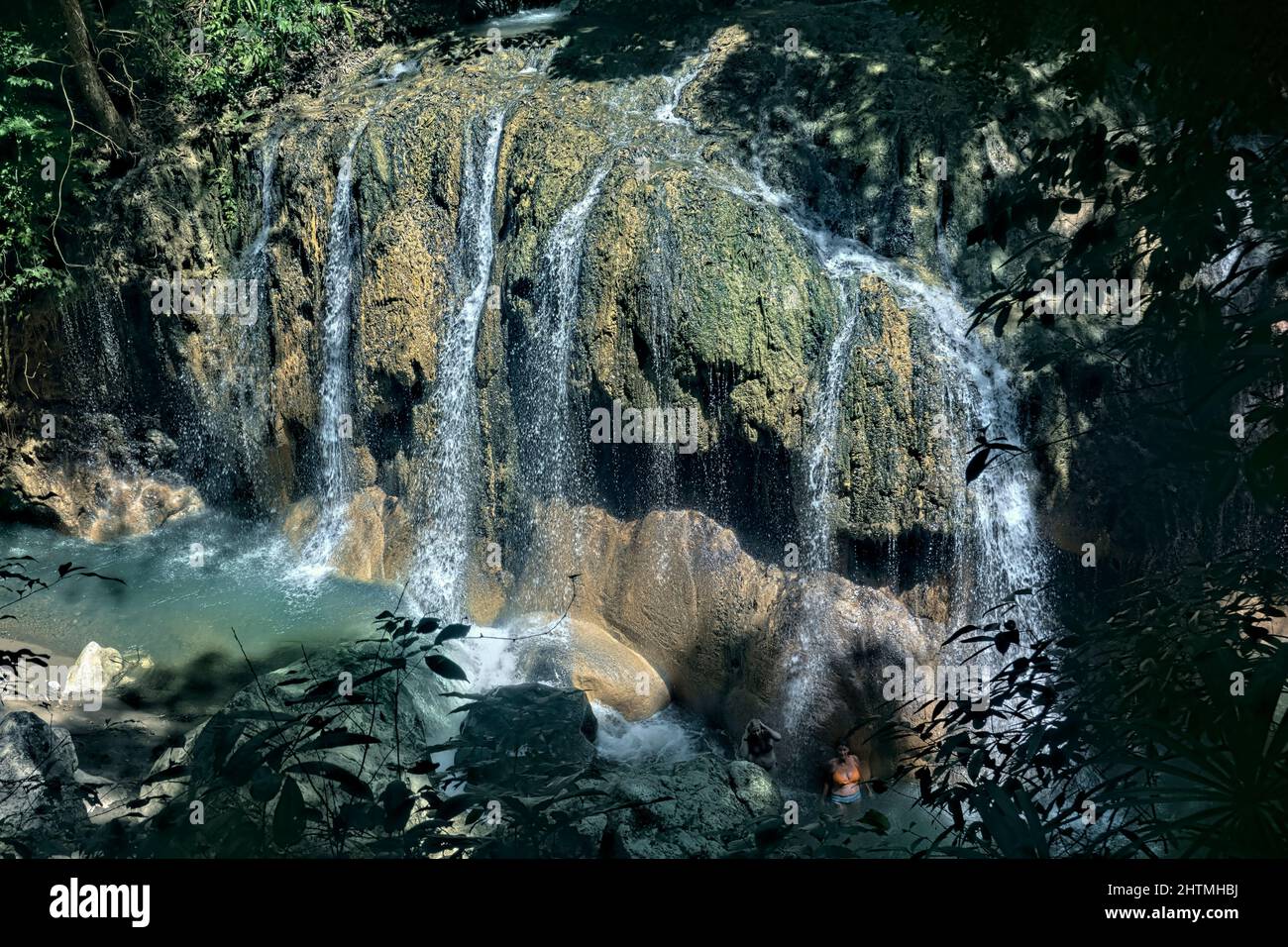Enjoying the hot spring waterfall of Finca Paraiso, Rio Dulce ...