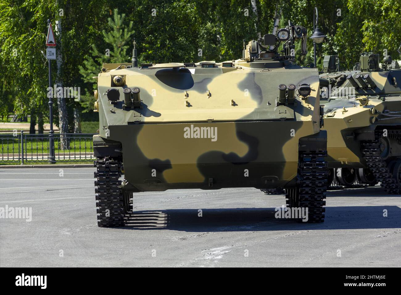 Russian military vehicles on the city square. Russian infantry fighting ...
