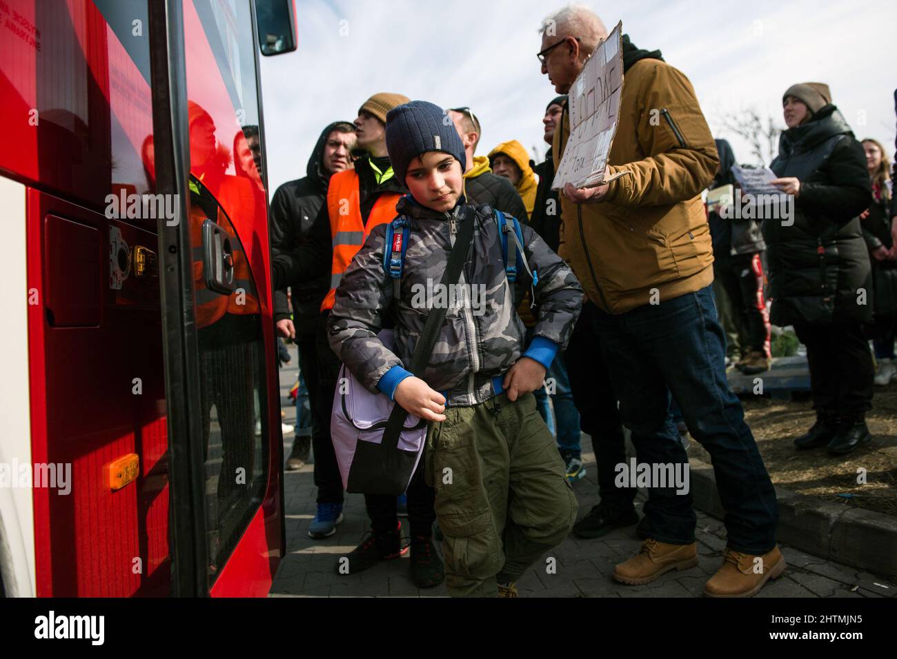 Ukrainian children are leaving the coach at the temporary bus stop in ...