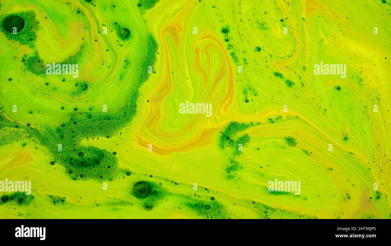 Mixing acidic paints. Stock footage. Bright acidic inks of different ...