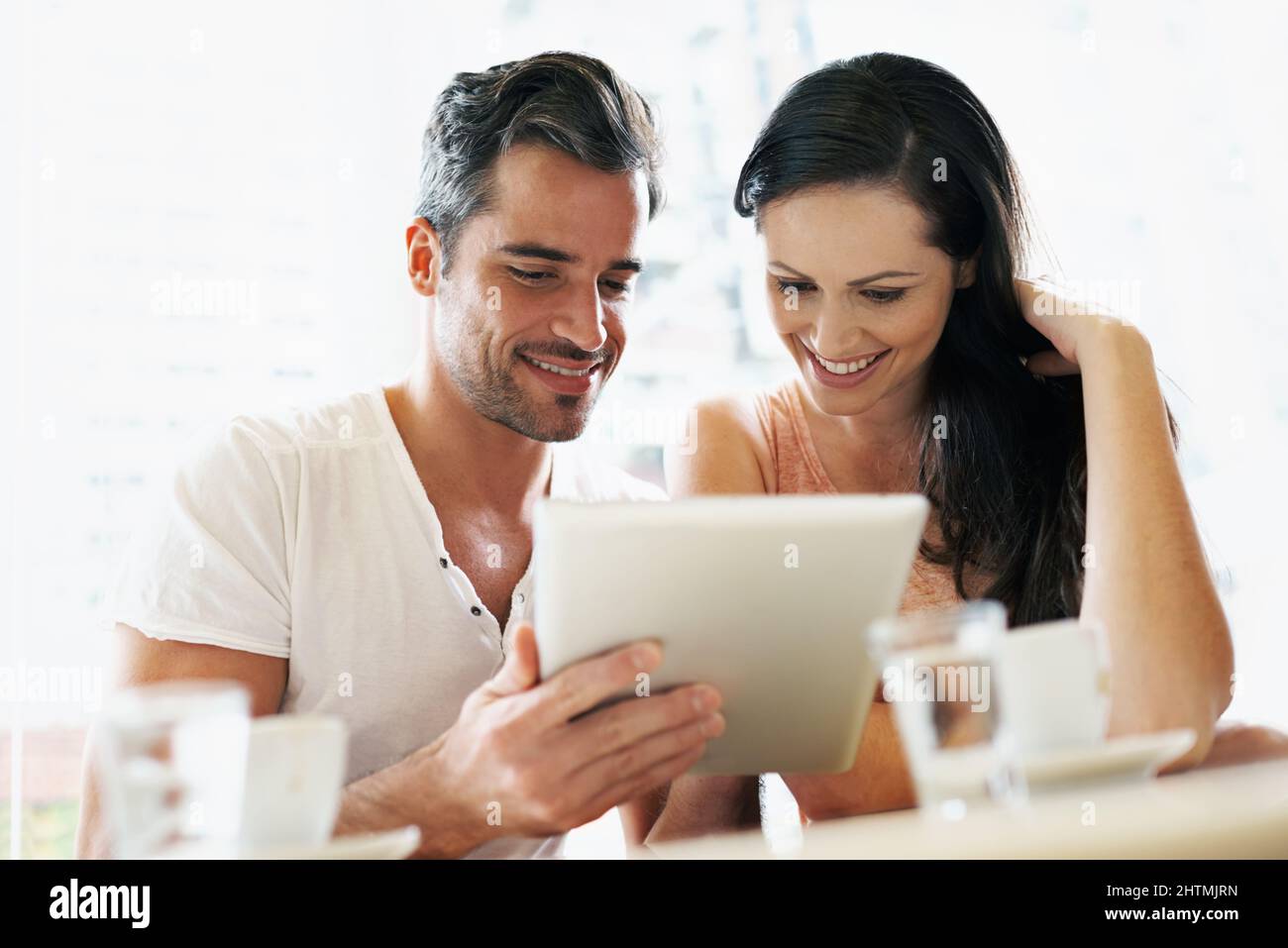 Using the wi-fi with my wifey. Shot of a young couple using their ...