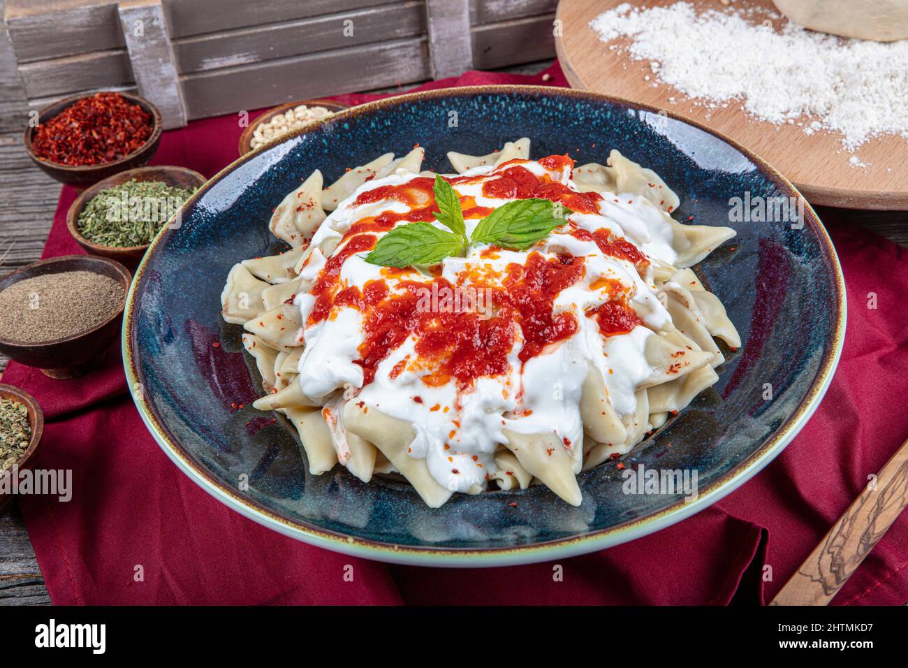 Plates of traditional Turkish food. Turkish Ravioli (Mantı) with ...
