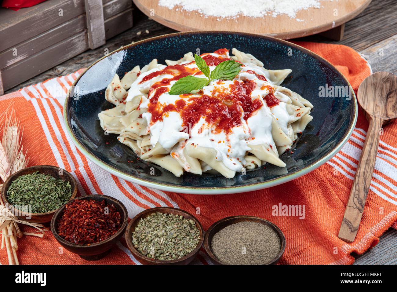 Plates of traditional Turkish food. Turkish Ravioli (Mantı) with ...