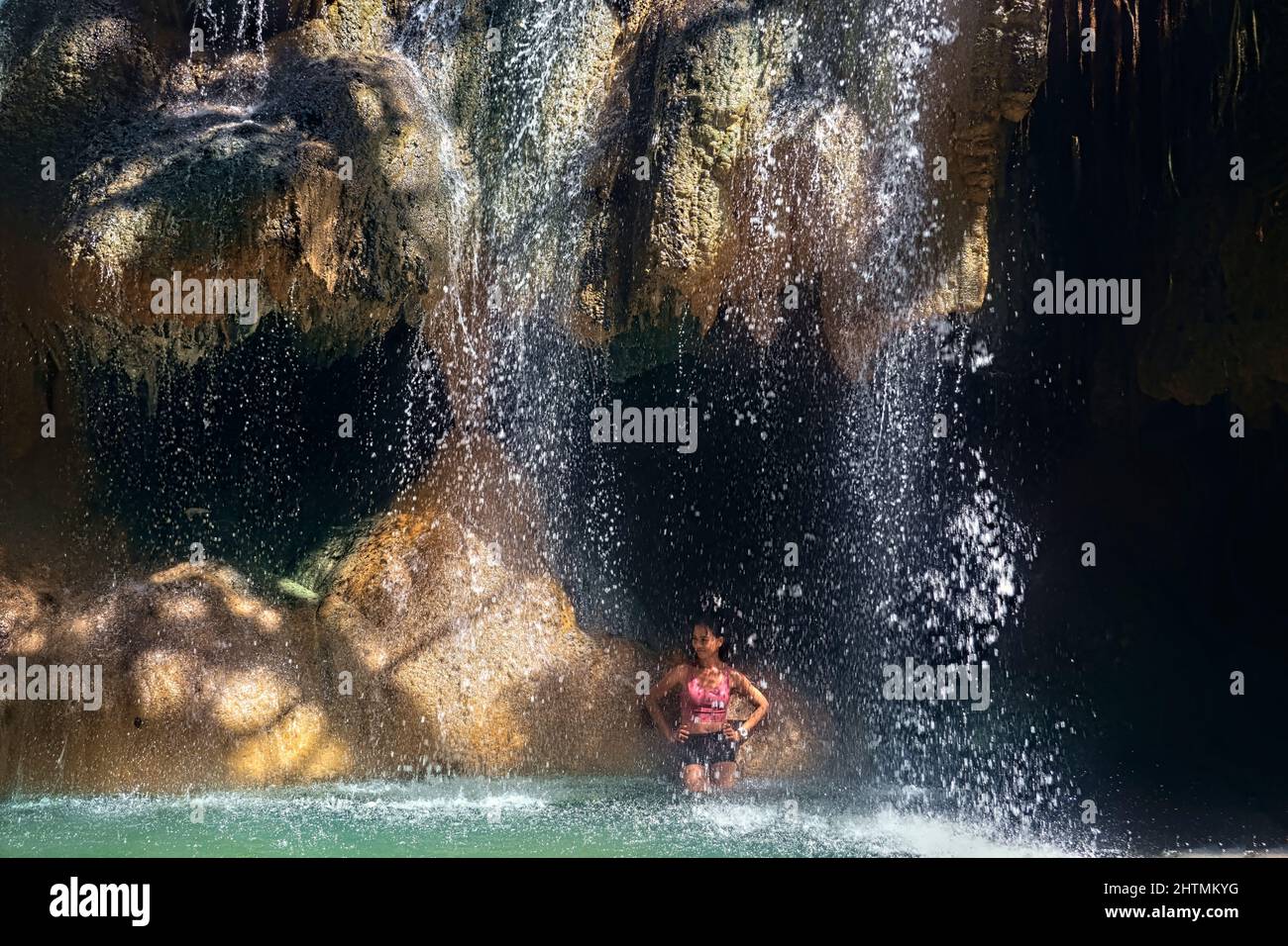Enjoying the hot spring waterfall of Finca Paraiso, Rio Dulce ...