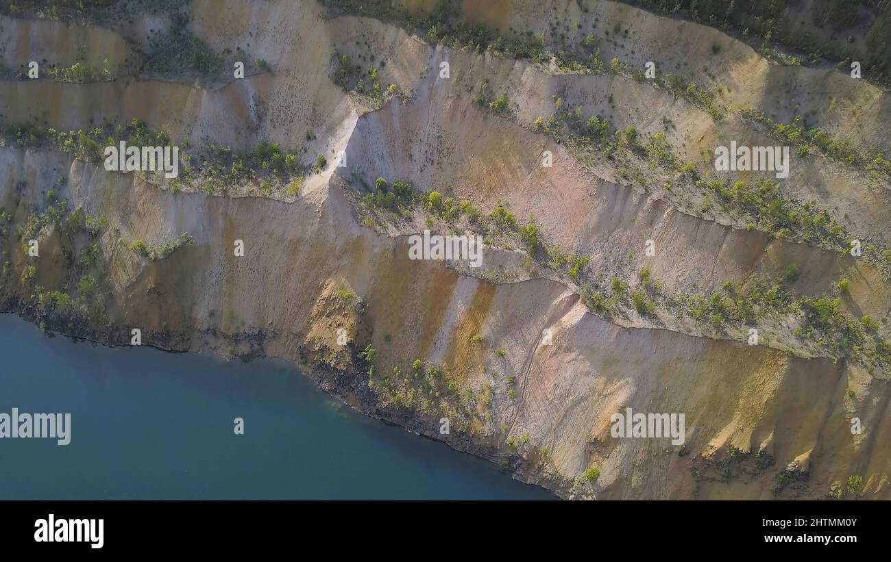 Abandoned large quarry filled with water. Clip. Top view of quarry ...