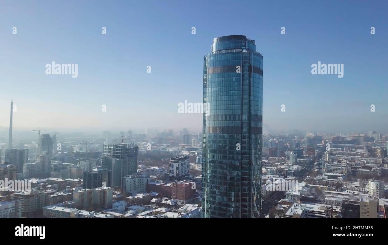 Top view of a skyscraper and modern city in winter. Gorgeous skyscraper ...