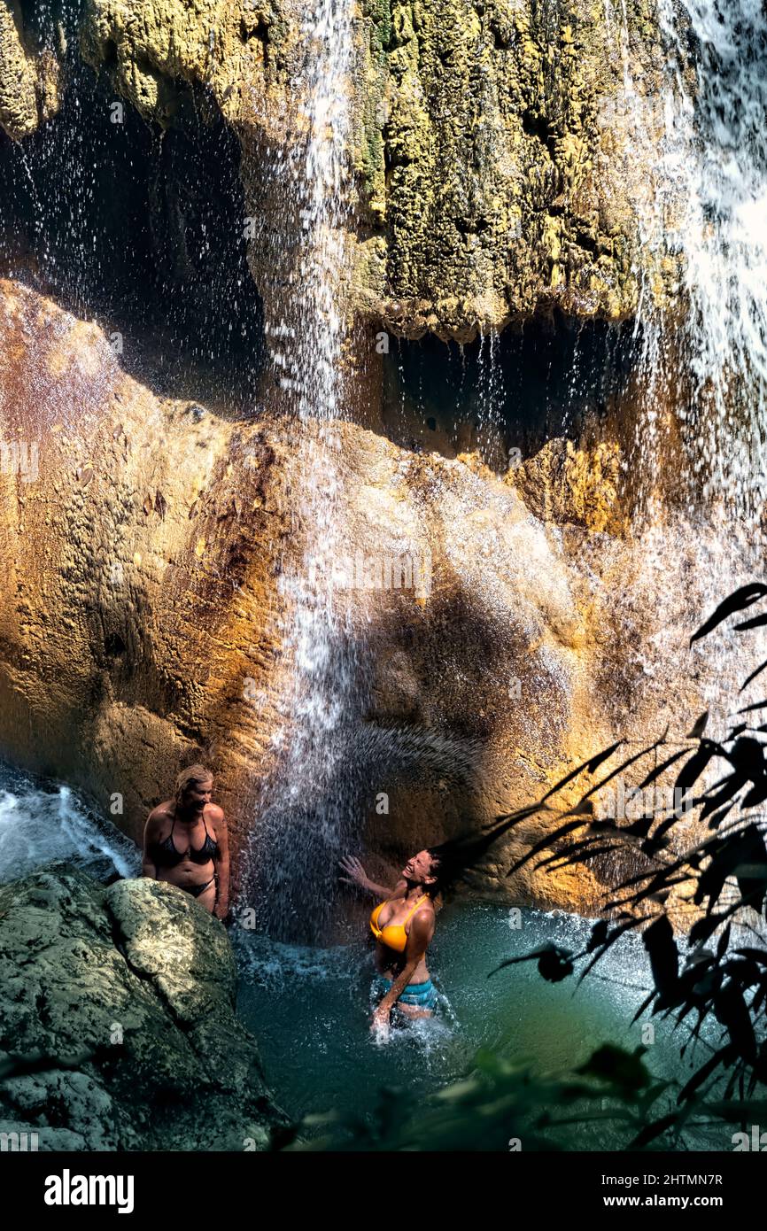 Enjoying the hot spring waterfall of Finca Paraiso, Rio Dulce ...